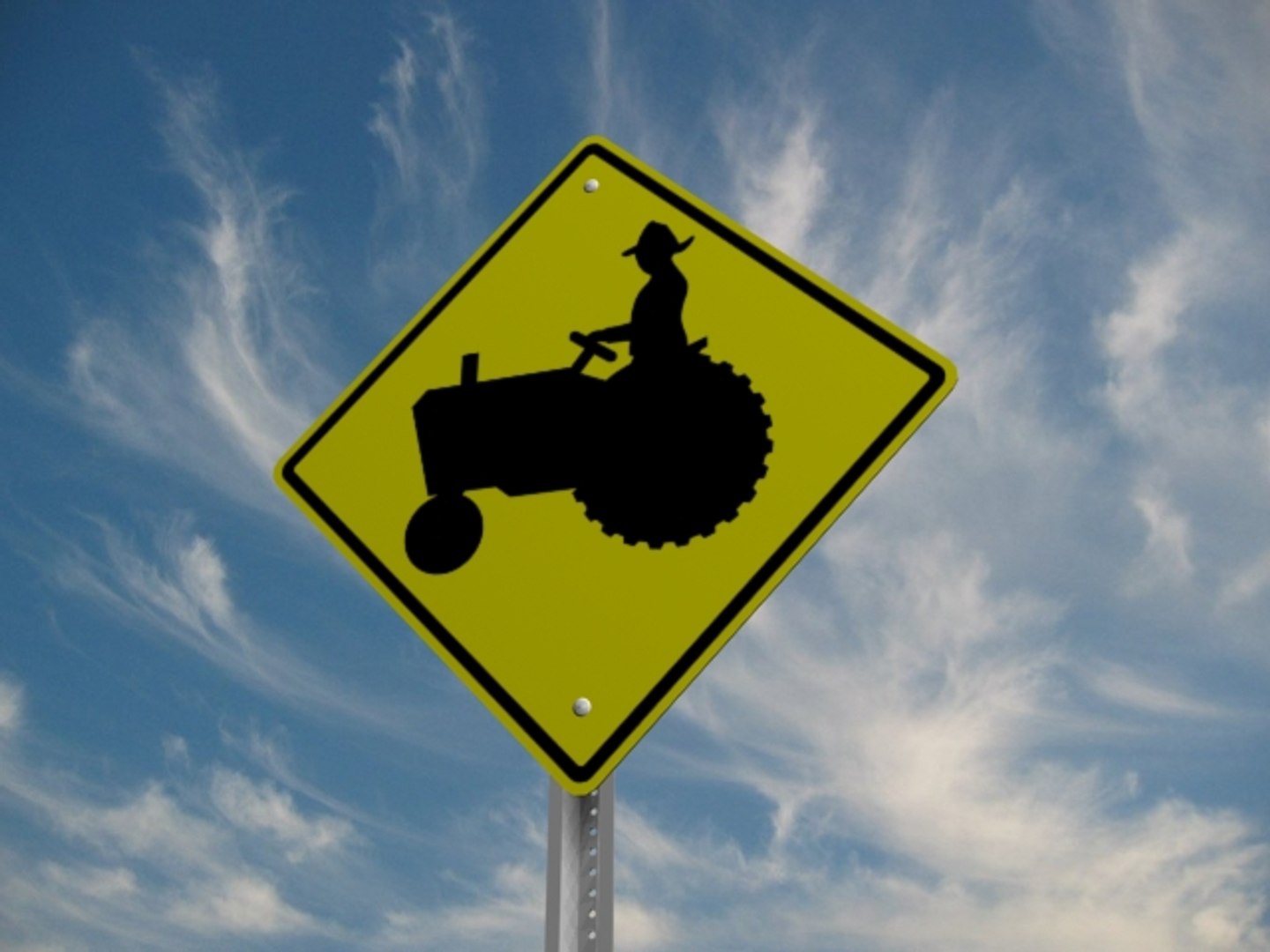 max tractor crossing street sign